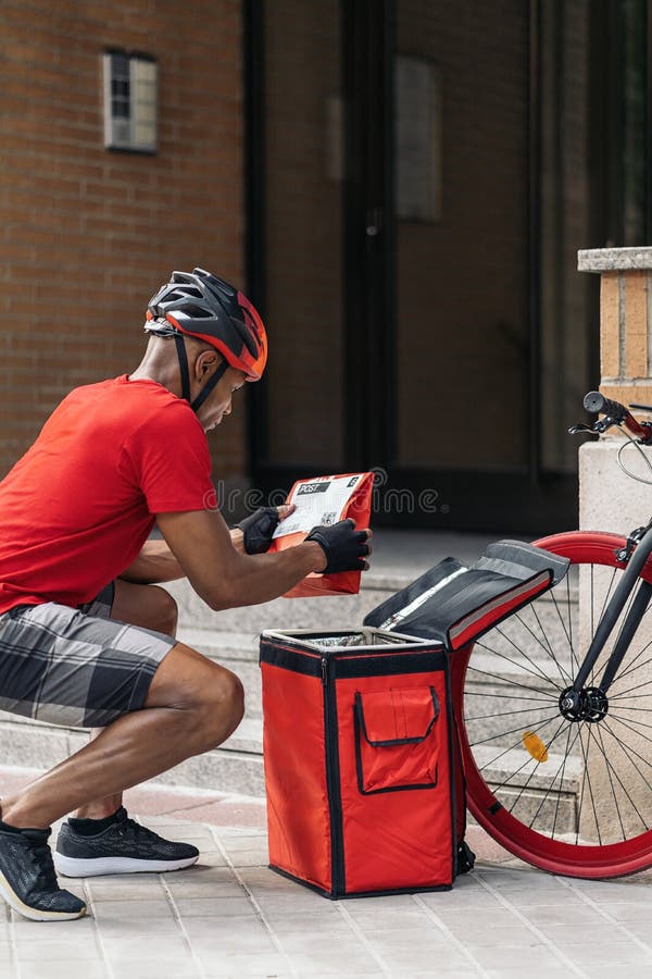 Delivery Man Preparing Order Stock Image - Image of helmet, occupation ...