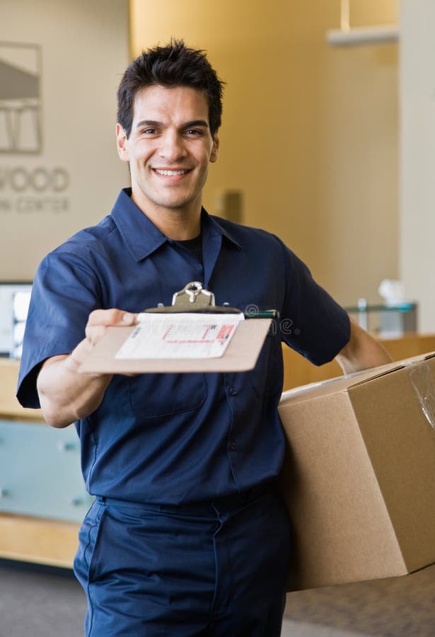 Delivery Man Presenting Shipping Receipt Stock Photo - Image of ...