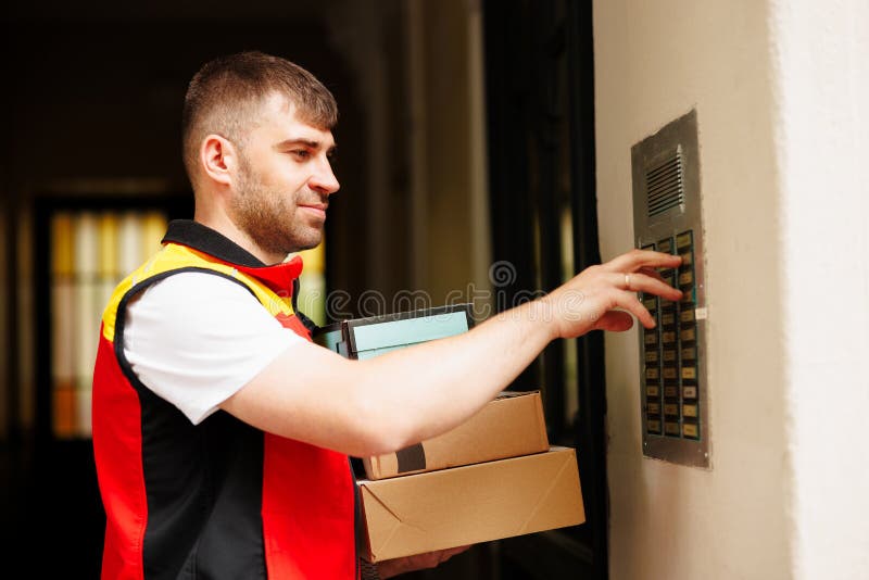 Delivery Man Pressing Button of Intercom Down the Street Stock Image ...