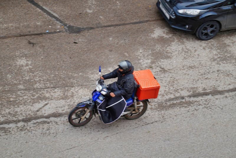 Delivery Man Riding a Motorcycle on the Road Stock Image - Image of ...