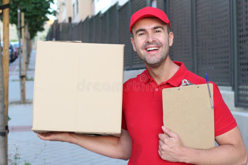 Delivery Man Smiling at Work Stock Photo - Image of holding, order ...