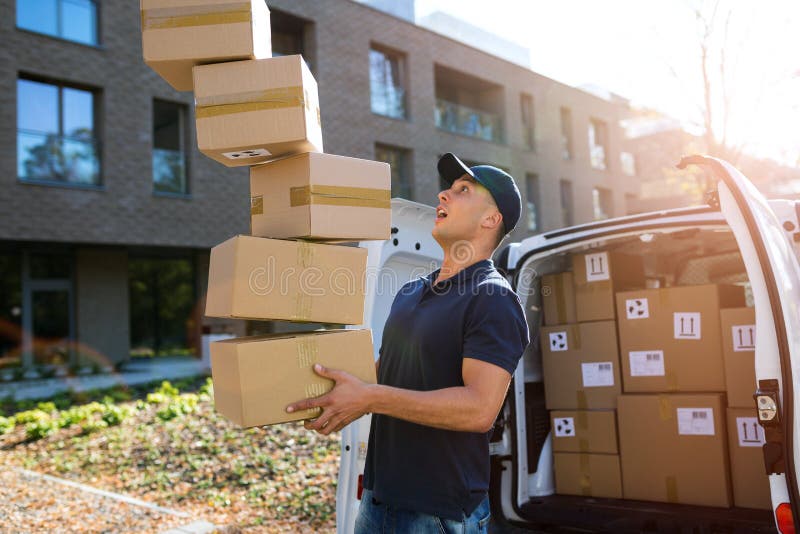 Delivery Man Dropping Boxes Stock Photo - Image of employee, mover ...