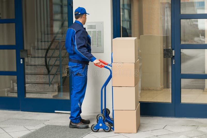 Delivery Man with Trolley Using Security To Enter Building Stock Photo ...