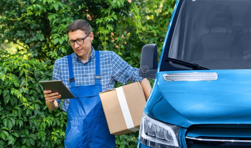 Delivery Man in Uniform with Digital Tablet Next To Van Stock Photo ...