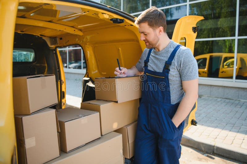 Delivery Men Unloading Moving Boxes from Car Stock Photo - Image of ...