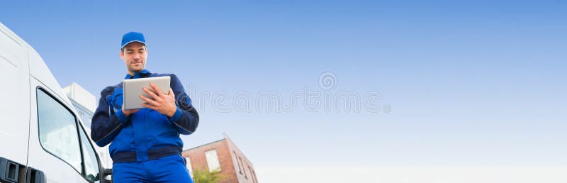 Delivery Man Using Digital Tablet by Truck Against Sky Stock Image ...