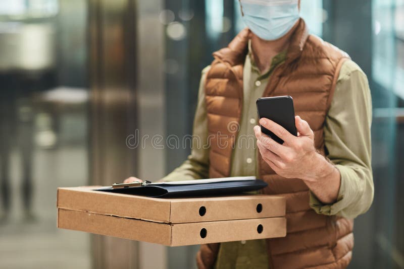Delivery Man Using Smartphone Stock Photo - Image of pizza, mail: 225381664