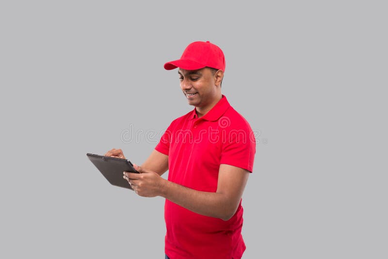 Delivery Man Using Tablet. Indian Delivery Boy with Tablet Stock Photo ...