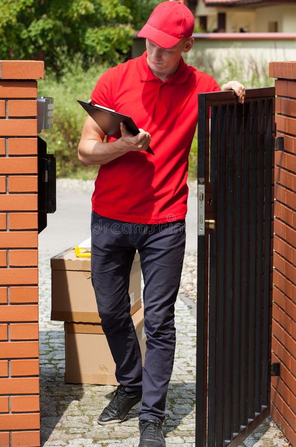 Delivery man at front door stock image. Image of documents - 44965639