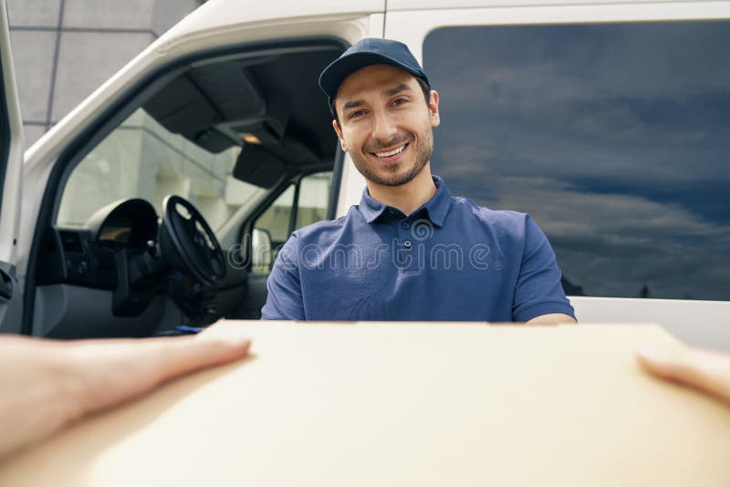 Delivery man at work stock image. Image of camera, happiness - 224812467