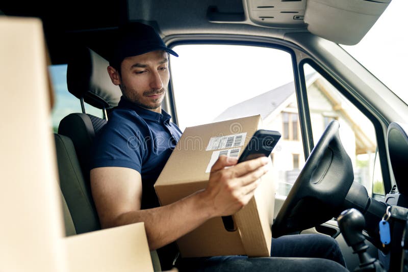 Delivery man at work stock photo. Image of holding, device - 224812010