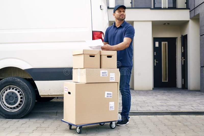 Delivery man at work stock photo. Image of courier, labor - 224811510