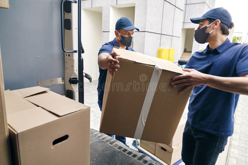 Delivery Man at Work during the Covid Stock Photo - Image of delivering ...