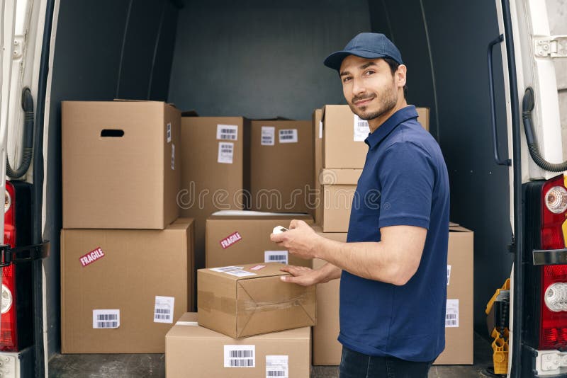 Delivery man at work stock image. Image of device, outdoors - 224811847
