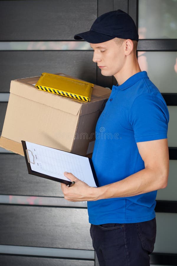 Delivery man during work stock photo. Image of door, entrance - 43413170