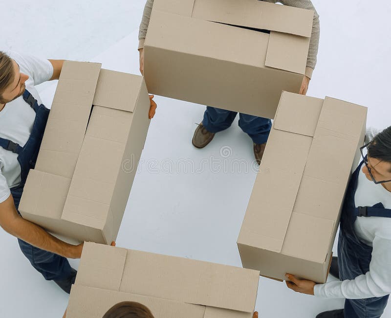 Delivery Men with Cardboard Boxes on White Background. Stock Photo ...