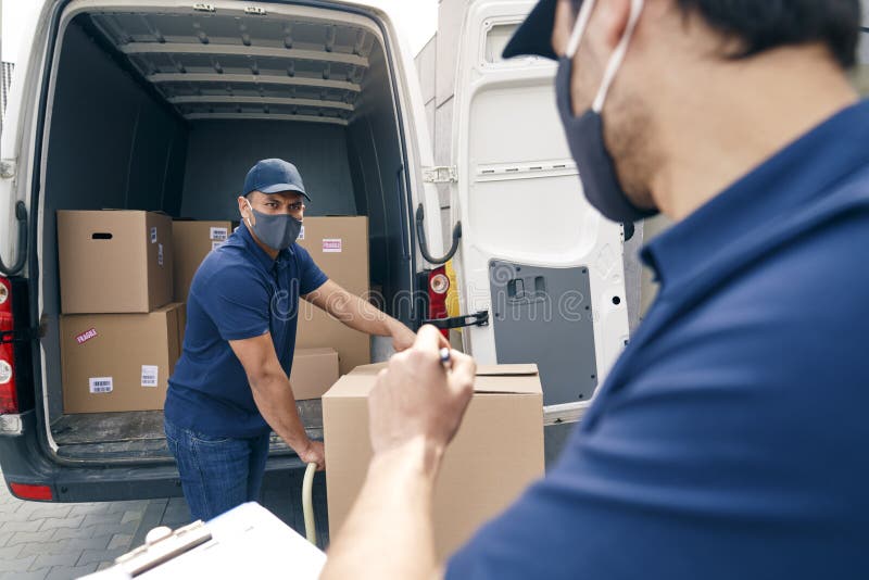 Delivery Men at Work during the Covid Stock Image - Image of covid19 ...