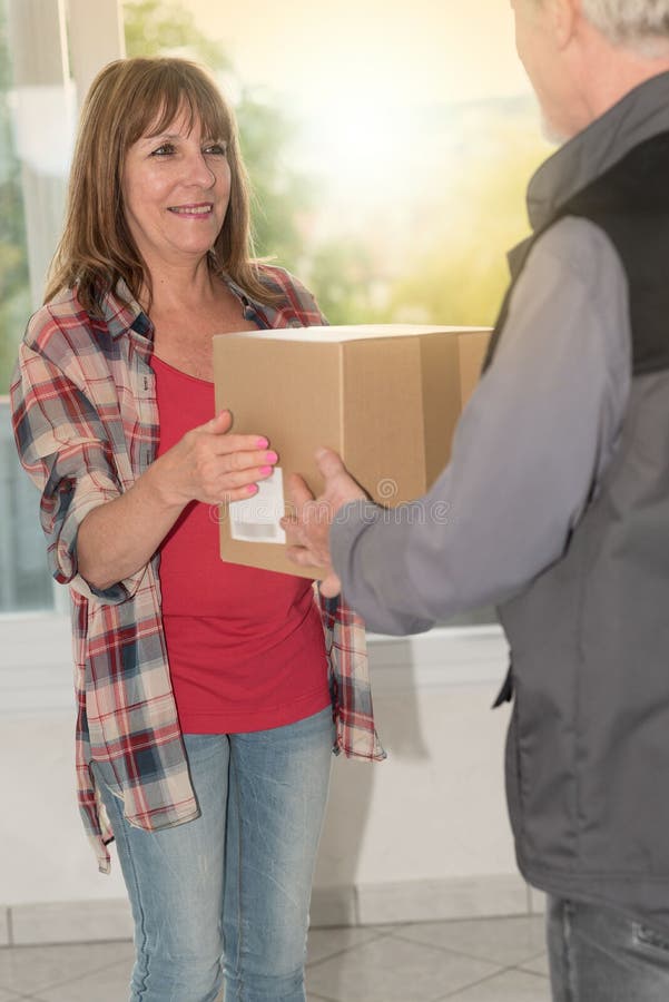 Delivery of a Package by a Deliveryman, Light Effect Stock Image ...
