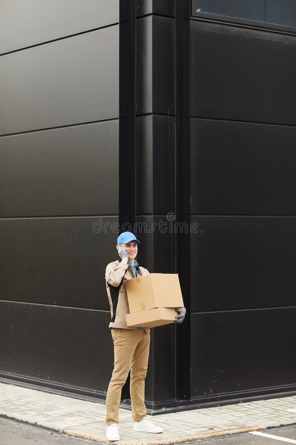 Delivery Person Carrying Boxes Stock Image - Image of street, factory ...