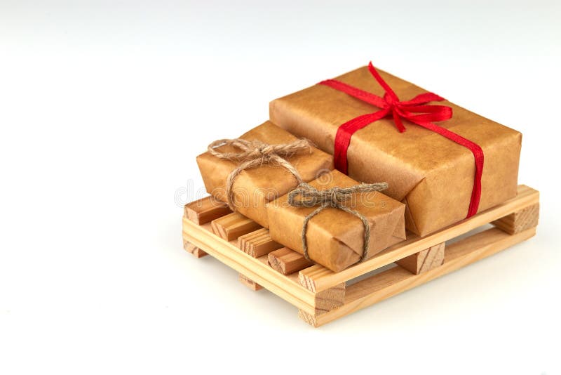 Delivery Presents in Three Boxes with Red Ribbon on Pallet for Goods ...