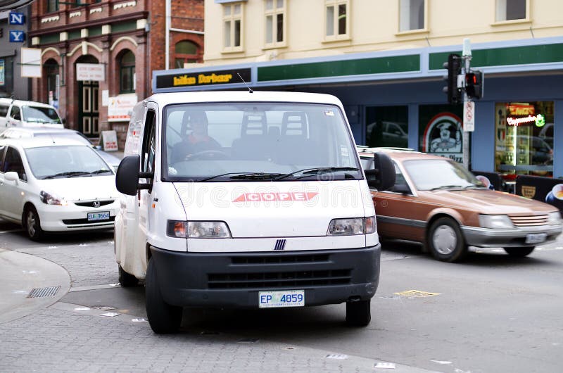 Delivery Small Van Navigating through Traffic Editorial Stock Image ... Delivery Small Van Navigating through Traffic Editorial Stock Image ...