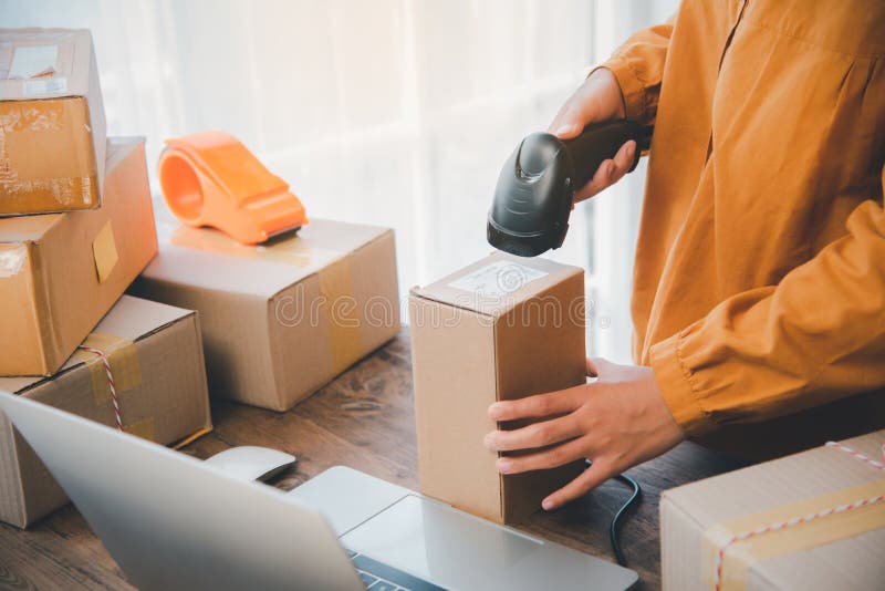 Delivery Staff Scanning Cardboard Box with Barcode Scanner To Check ...