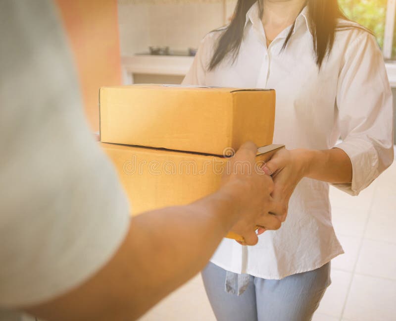 Delivery Staff Uniform Handing a Parcel Box Receiving Parcel Stock ...
