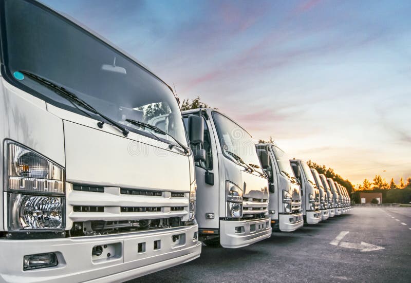 Delivery Trucks Fleet in a Row Stock Photo - Image of logistics, large ...