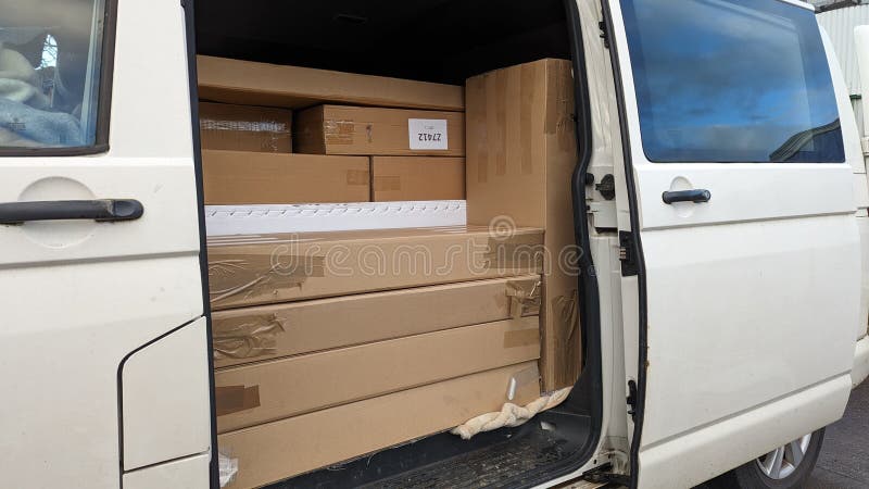 A Delivery Van Packed with Parcels and Boxes Ready for Delivery Stock ...