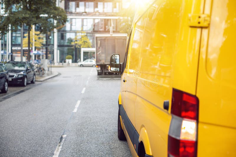 Delivery Van on a Street Inside a City Stock Photo - Image of transport ...