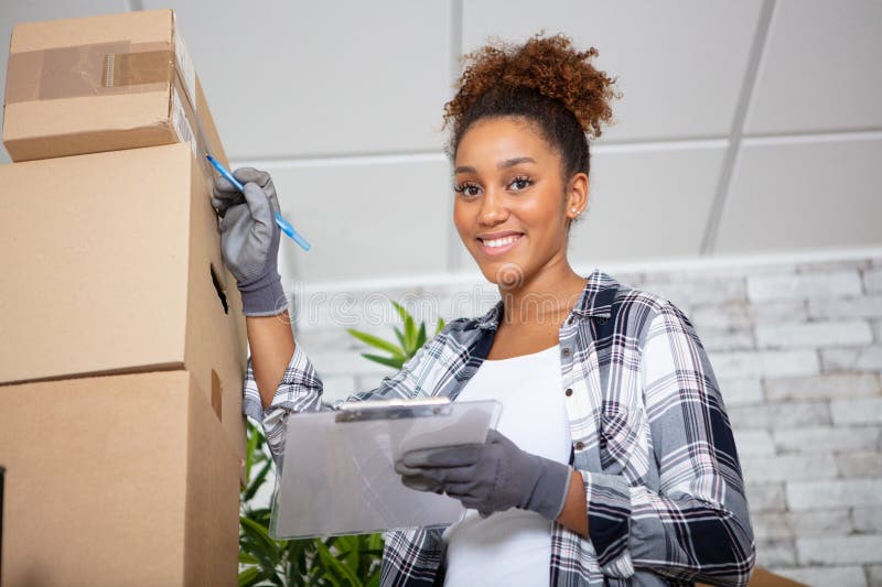 Delivery Woman with Boxes Stacked on Hand Truck Stock Image - Image of ...