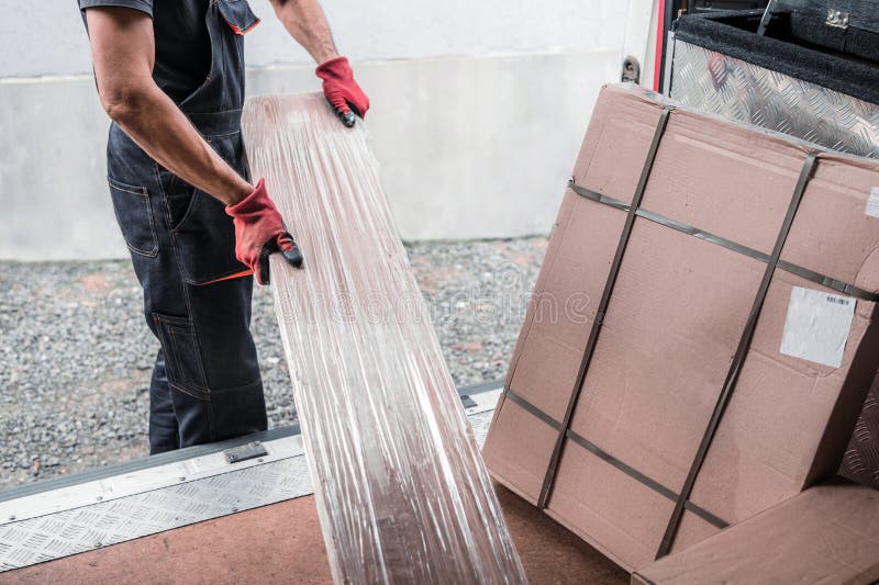 Delivery Worker Unloading Packages from Cargo Vehicle Efficiently Stock ...