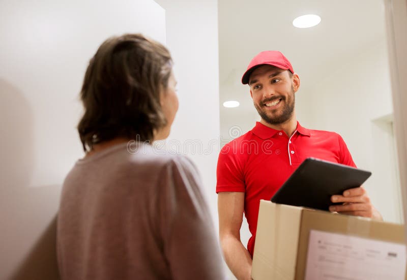 Deliveryman with Tablet Pc and Box at Customer Stock Photo - Image of ...