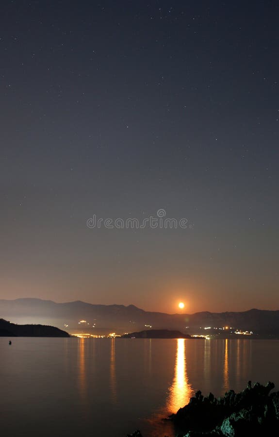 Rising moon on sea stock image. Image of silver, beam - 17826187