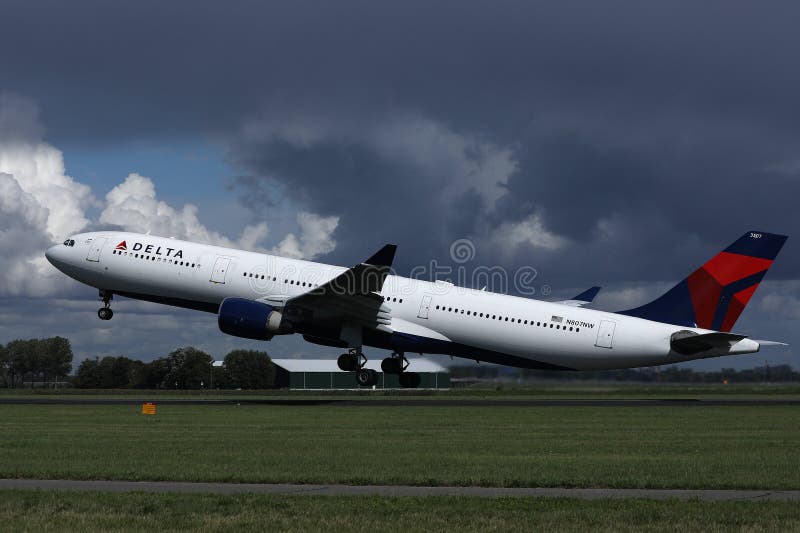 Delta Airlines Plane Taking Off from Runway, Clouds in the Sky ...