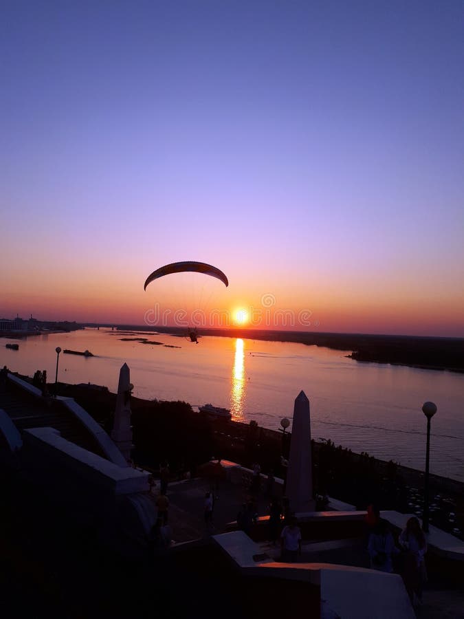 Delta Glider Flying Over the River Volga at Sunset Stock Photo - Image ...