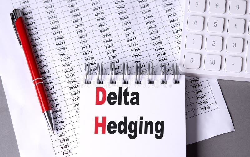 DELTA HEDGING Text on Notebook with Chart , Pen and Calculator Stock ...