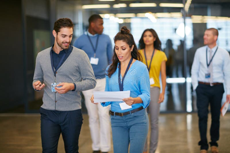 Delving through the Information. a Group of Businesspeople Walking into ...