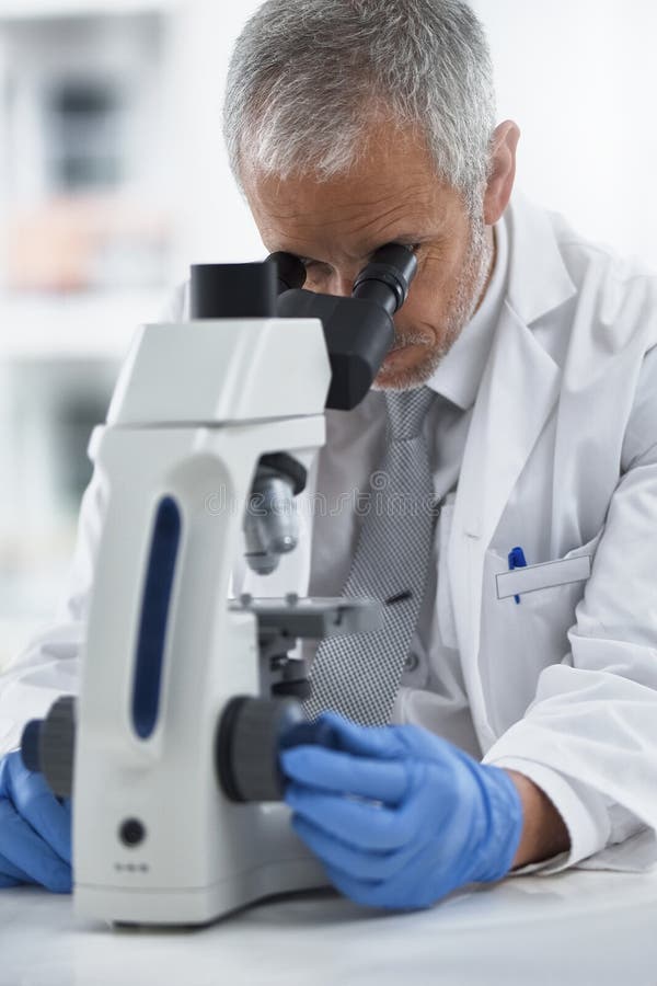 Delving into the Microscopic World. a Researcher at Work on a ...
