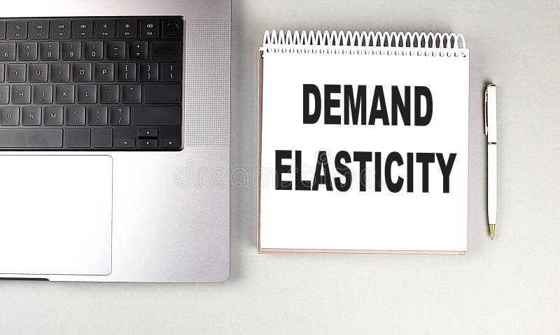 DEMAND ELASTICITY Text on Notebook with Laptop and Pen Stock Photo ...