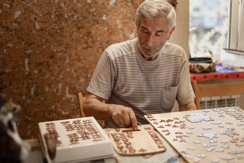 Dementia Prevention Elderly Man Hands Doing Jigsaw Puzzle Stock Photos ...