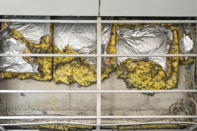 Demolished Insulation with Traces of Fire on a Concrete Wall Behind an ...