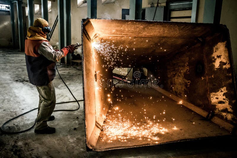 Demolition Construction Worker Using a Flame Torch To Cut Up Heavy ...