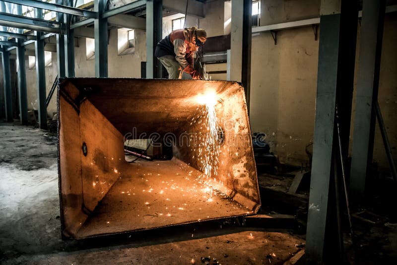 Demolition Construction Worker Using a Flame Torch To Cut Up Heavy ...
