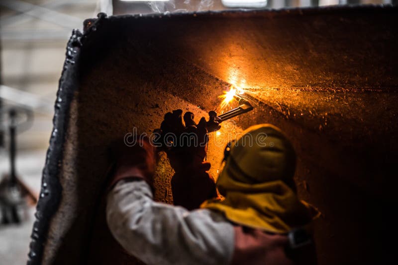 Demolition Construction Worker Using a Flame Torch To Cut Up Heavy ...