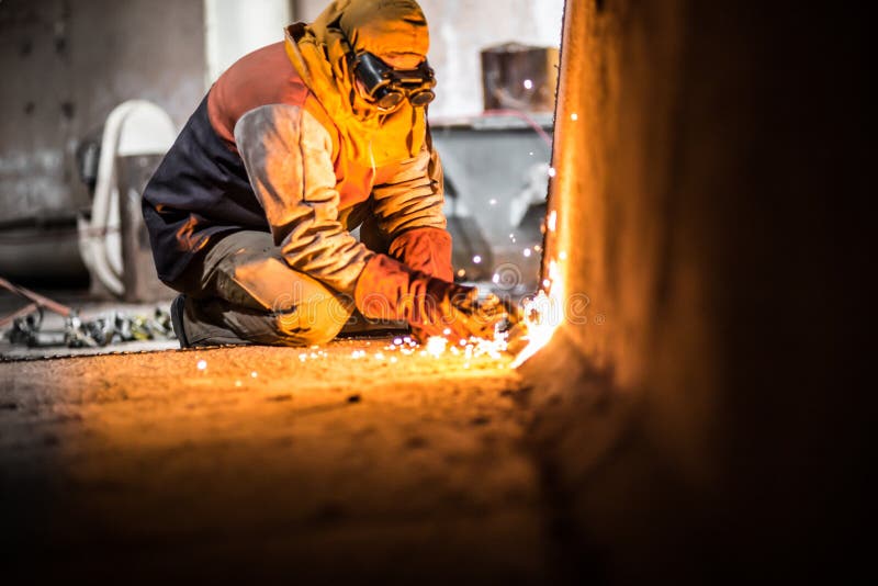 Demolition Construction Worker Using a Flame Torch To Cut Up Heavy ...