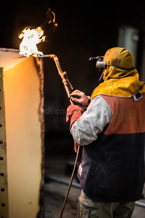 Demolition Construction Worker Using a Flame Torch To Cut Up Heavy ...
