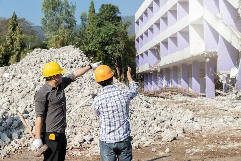 Demolition Control Supervisor and Contractor Discussing on Demolish ...
