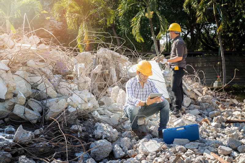 Demolition Control Supervisor and Contractor Working on Demolish ...