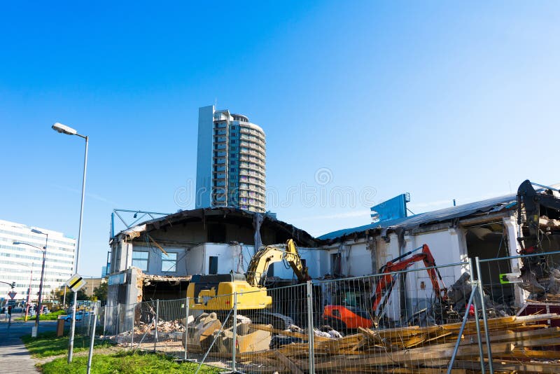 Demolition of the Old Building with Sloopkraan Against Blue Clouds Sky ...